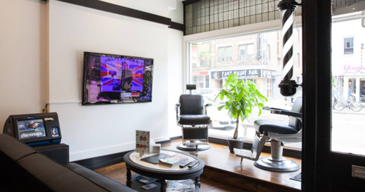 New barber shop has a big screen TV at every chair