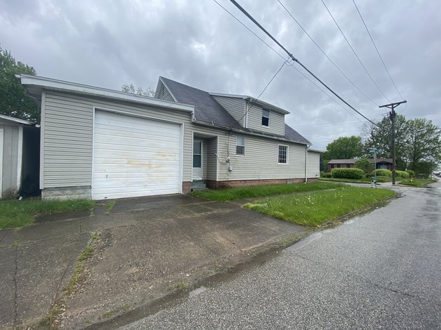 Home on Corner Lot with Multiple Garages