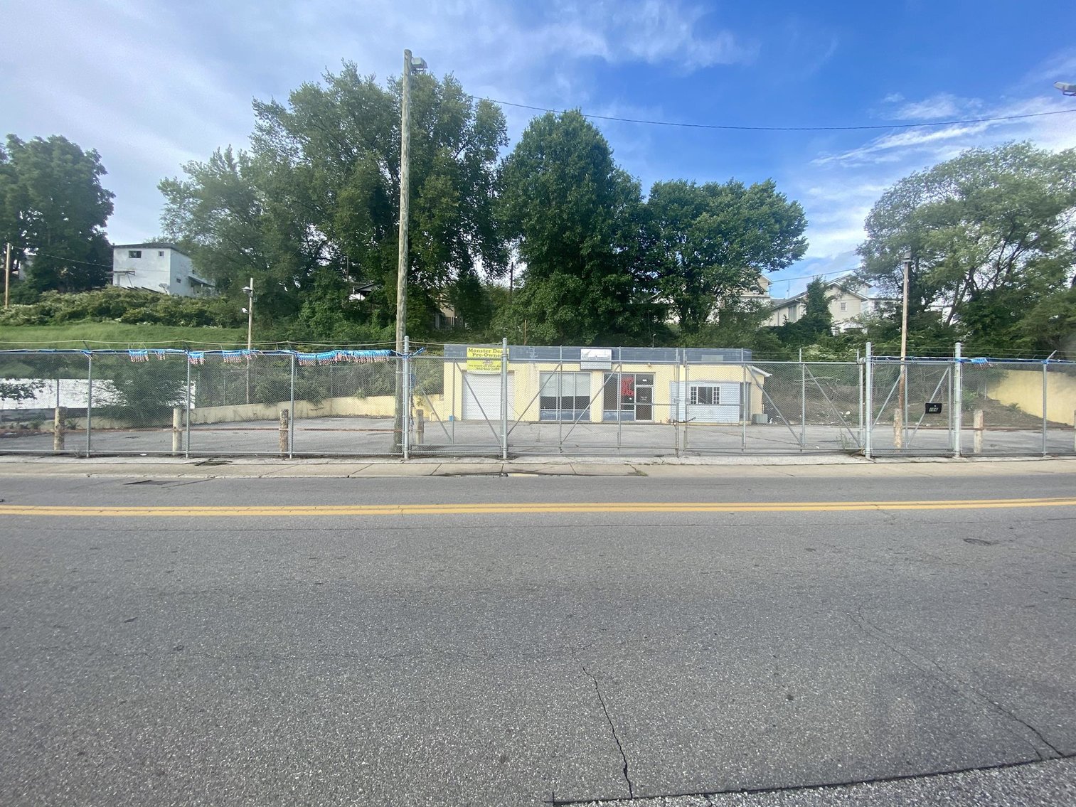 Fenced Commercial Lot Sold to the Highest Bidder