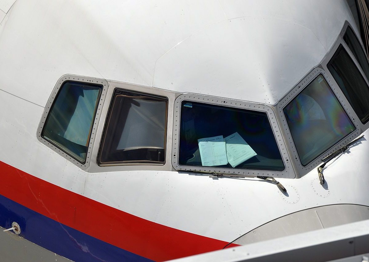 A pilot got partially sucked out of plane after the windshield shattered