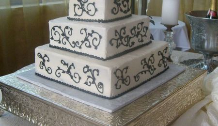 Scrolls And Cameo Wedding Cake - CakeCentral.com