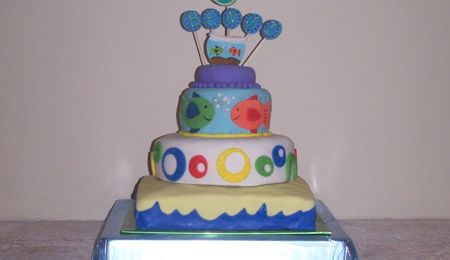 Sailboat Birthday Cake With Gradient Colored Waves - CakeCentral.com