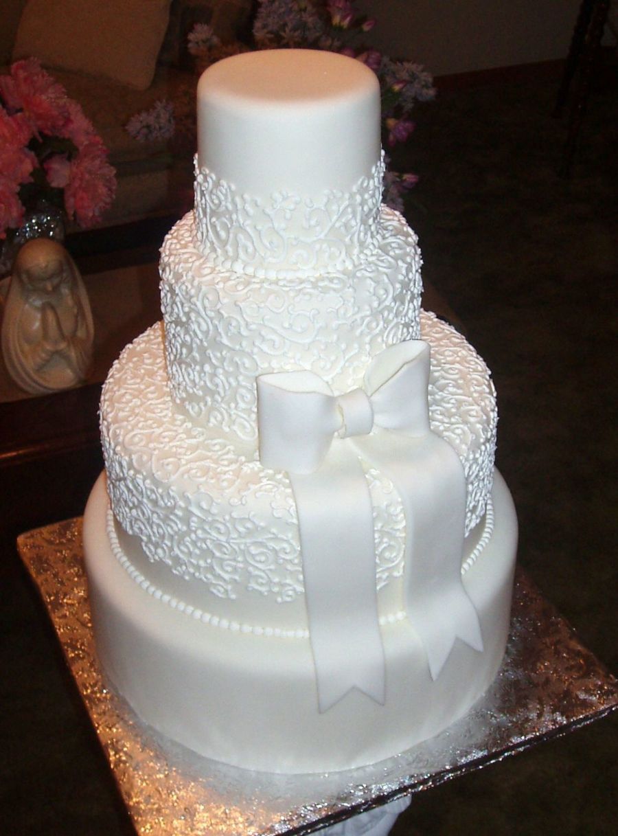 4-Layer Round Scroll Work & Bow - CakeCentral.com