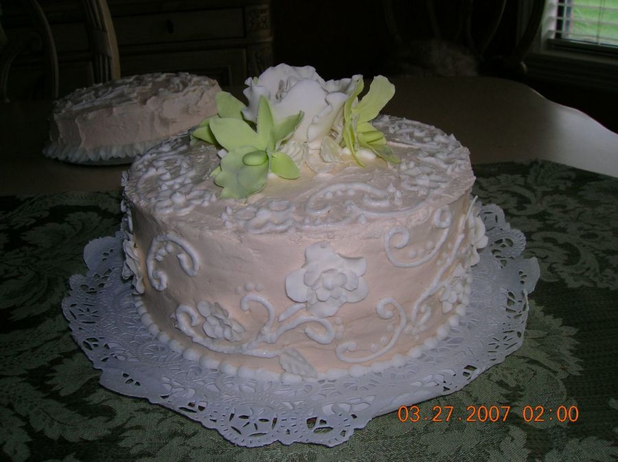 Side View Of Round Cream Colored Cake - CakeCentral.com