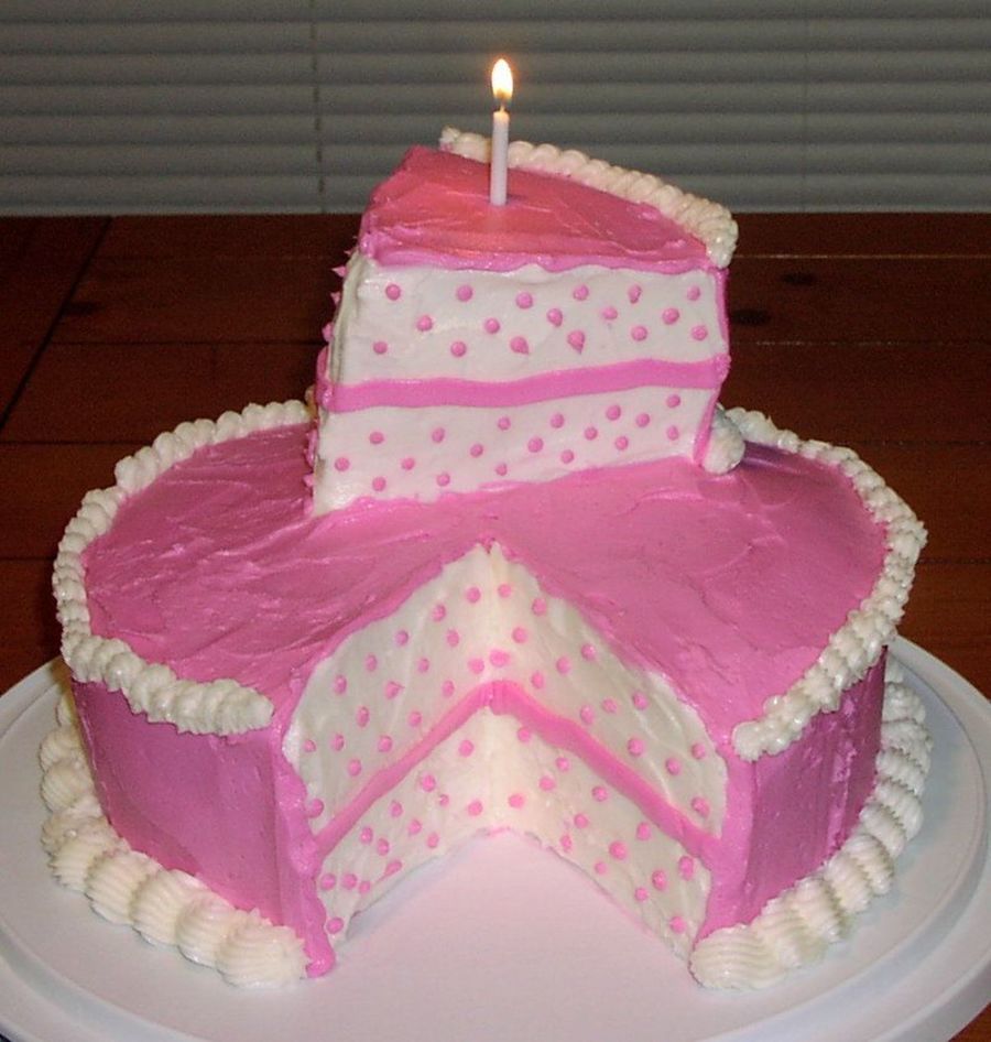 Pink Birthday Cake With Slice Ontop - CakeCentral.com