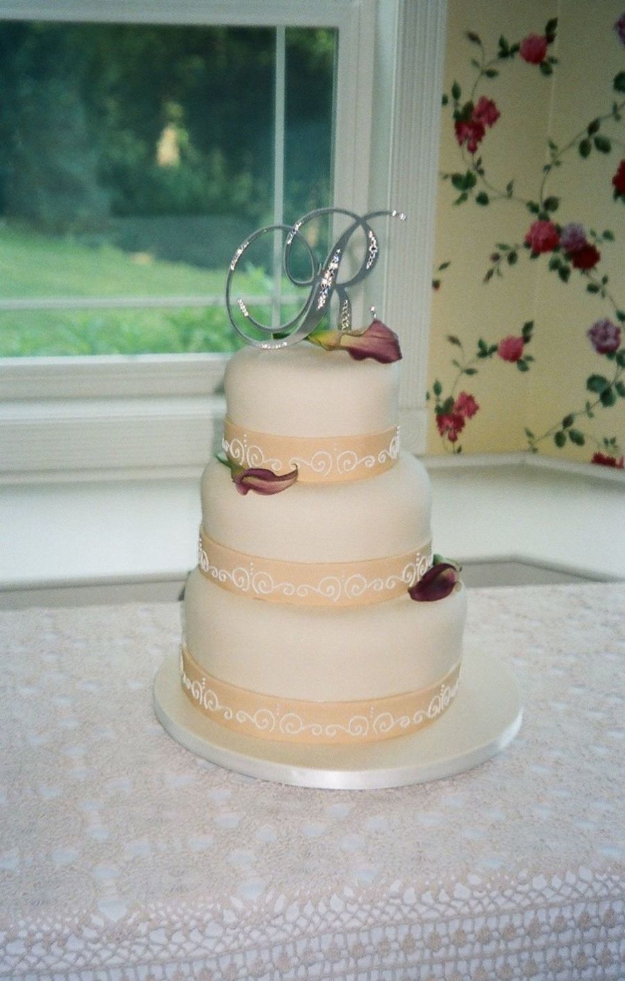 Simple Ivory With Scrolls And Callas - CakeCentral.com