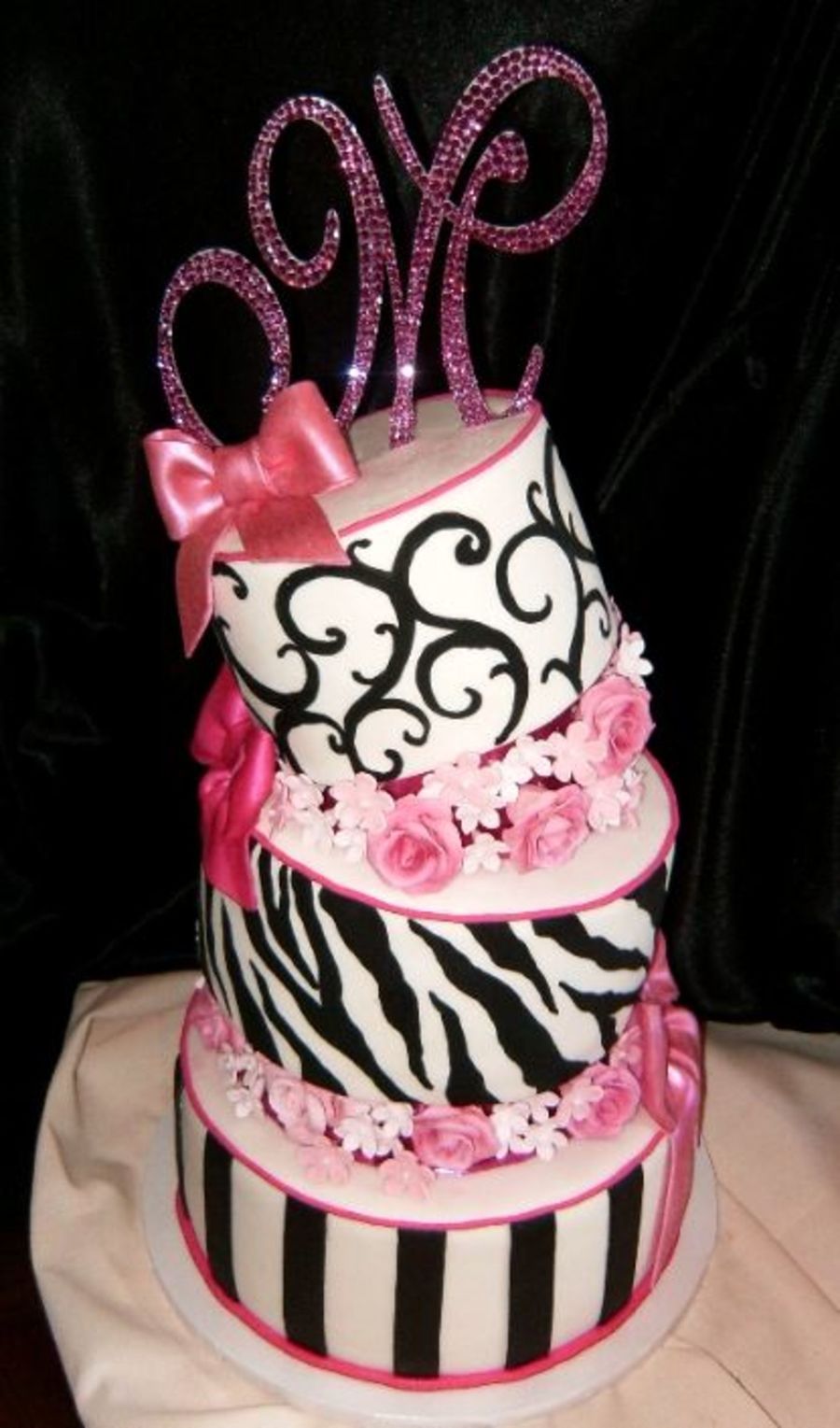 Black, Pink, And White Quinceanera Tilted Cake - CakeCentral.com