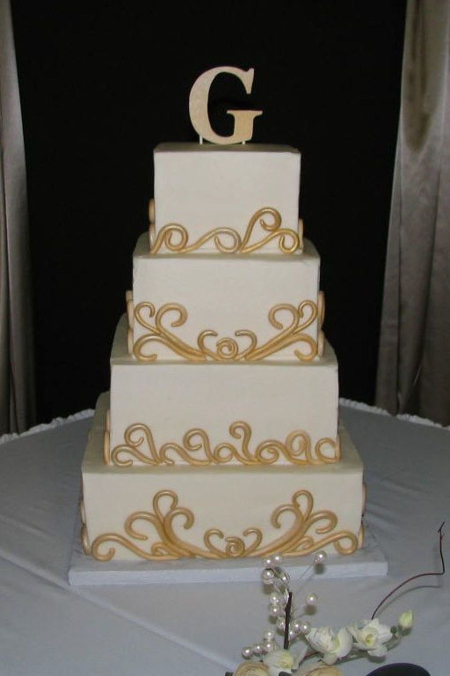 Gold Fondant Scrolls On 4 Tier Square - CakeCentral.com