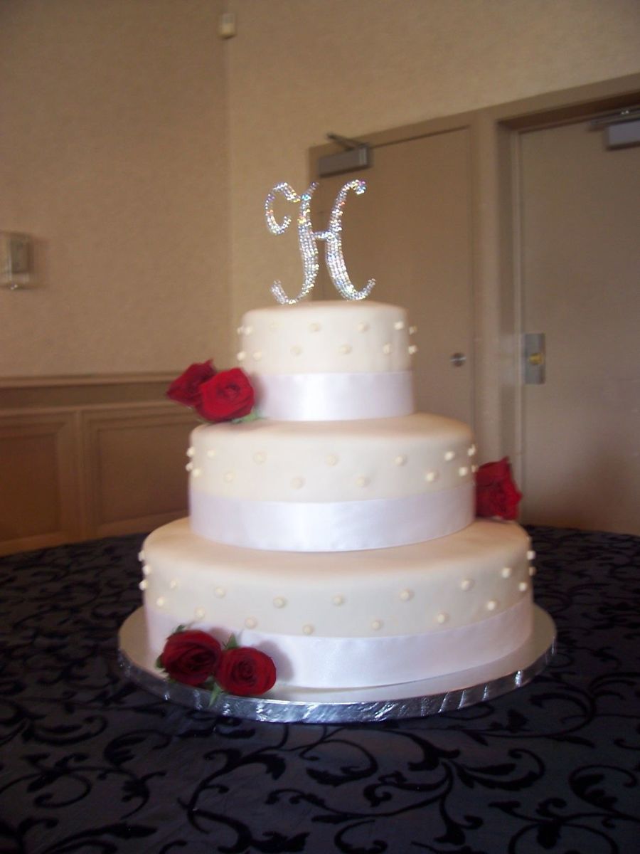 White Buttercream Wedding Cake With Red Roses - CakeCentral.com