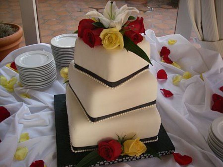 Square Wedding Cake With Yellow And Red Roses - CakeCentral.com
