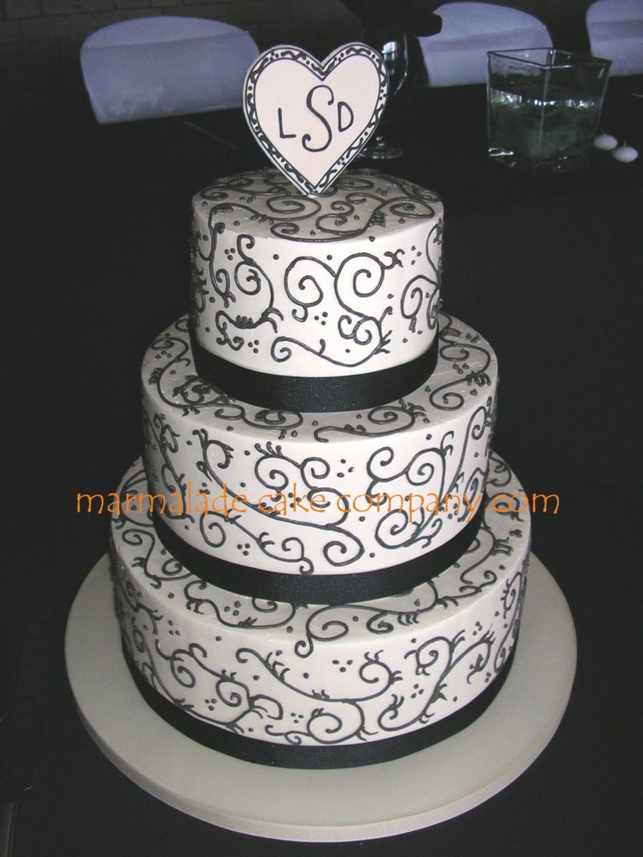 Black Scrollwork With Heart Topper - CakeCentral.com