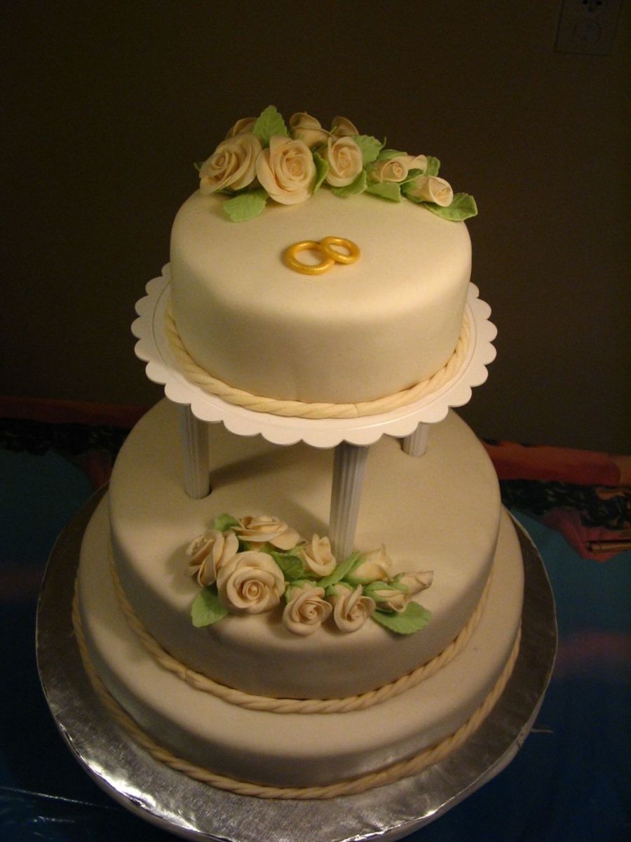 Ivory Wedding Cake With Roses - CakeCentral.com