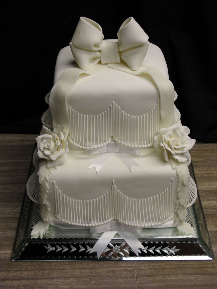 White On White Wedding Cake With Stringwork - CakeCentral.com