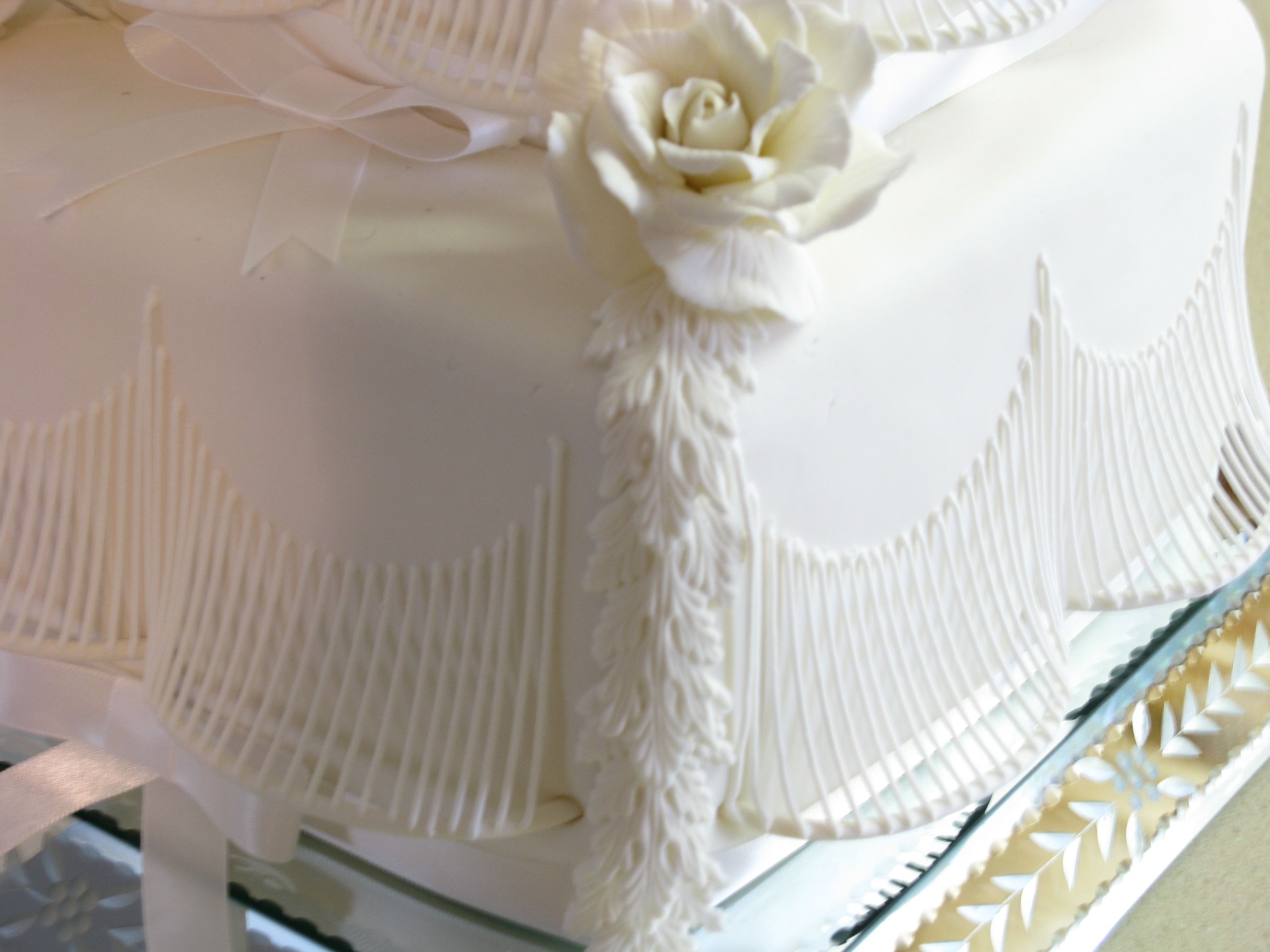White On White Wedding Cake With Stringwork - CakeCentral.com