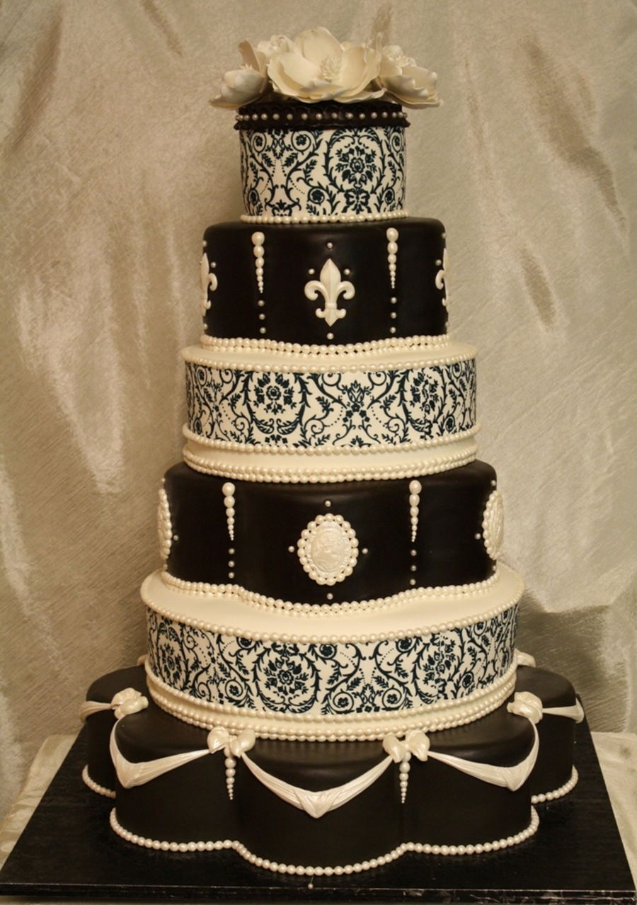 Scrolls And Cameo Wedding Cake - CakeCentral.com