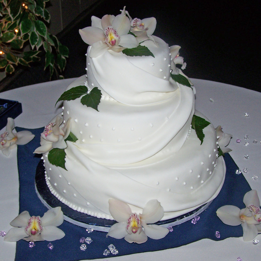 Draped Fondant And Orchids - CakeCentral.com