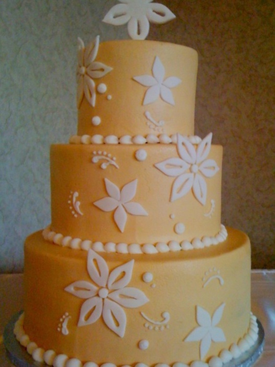 Orange And White Flowers Wedding Cake - CakeCentral.com