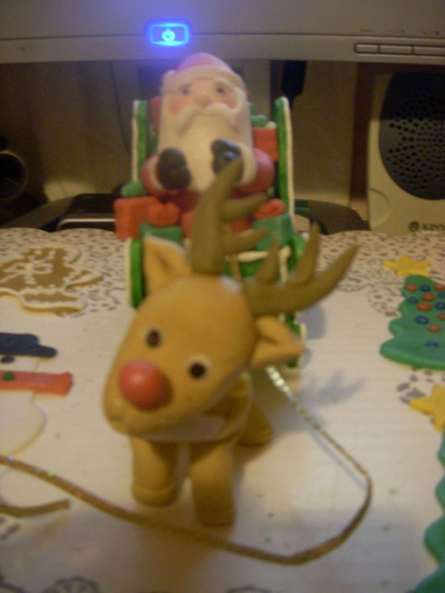 Gumpaste Santa And Rudolph - CakeCentral.com