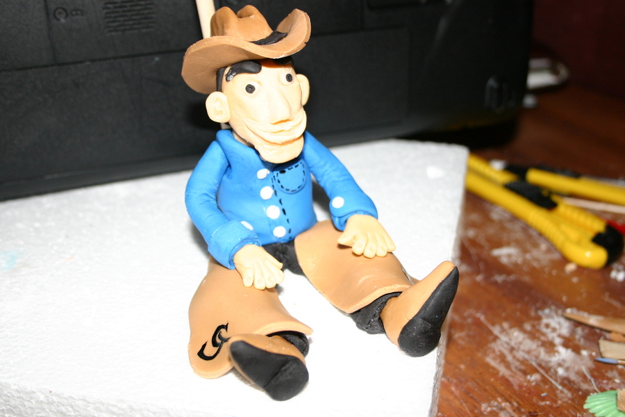 Fondant Cowboy With Sugar Budlight - CakeCentral.com