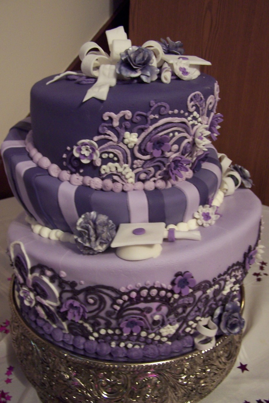 Purple Topsy Turvy Graduation Cake - CakeCentral.com