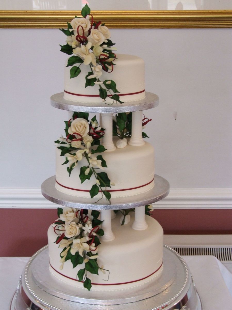 Oval Flower Spray Wedding Cake - CakeCentral.com