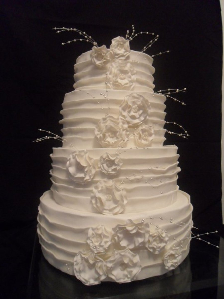 Draped White Wedding Cake - CakeCentral.com