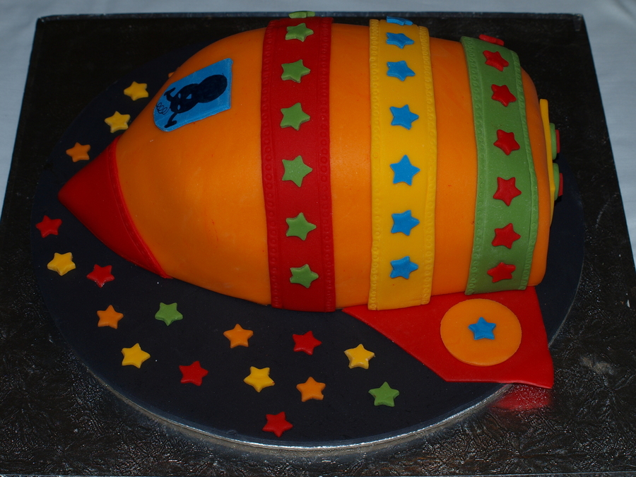 Bright Coloured Rocket - CakeCentral.com