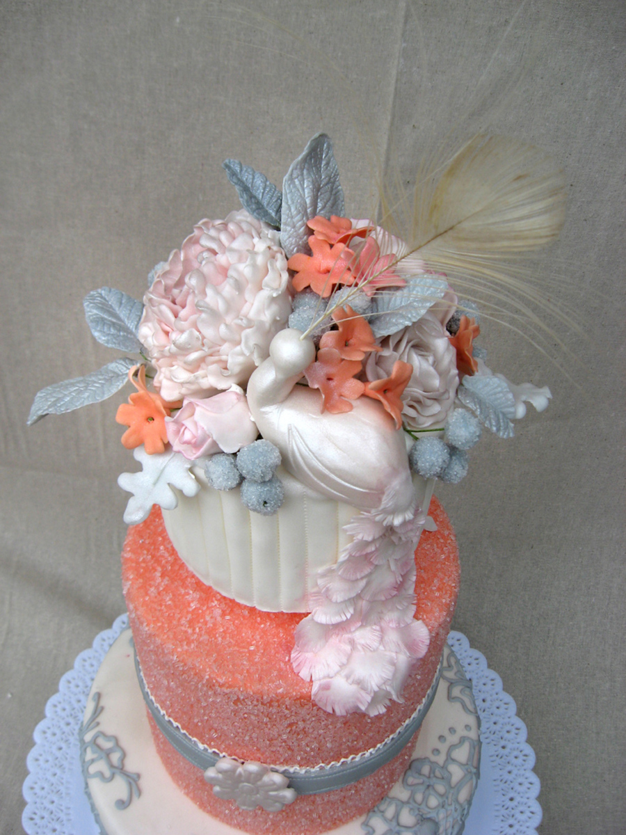 Coral Wedding Cake With Peacock Topper - CakeCentral.com