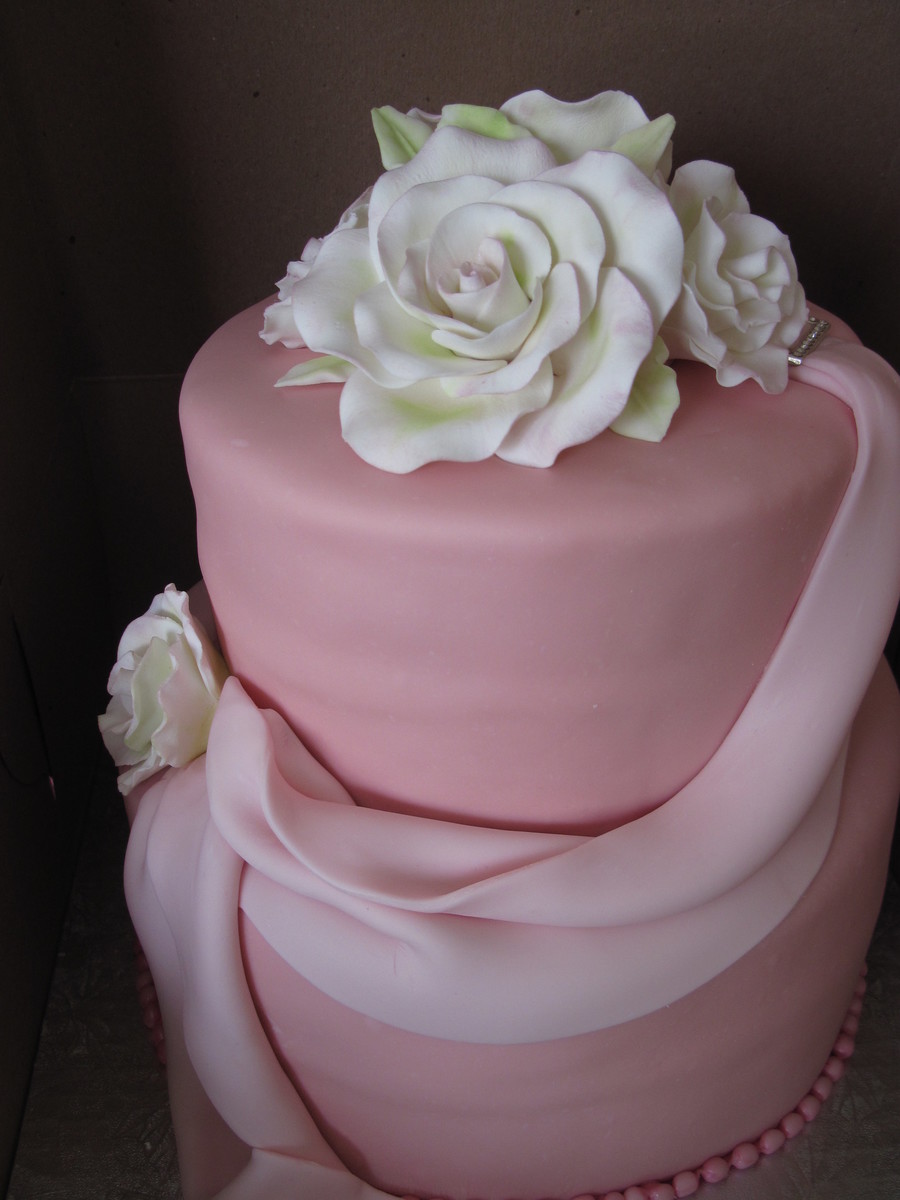 Pink With Light Pink Flowers And Some Bling And Draping - CakeCentral.com
