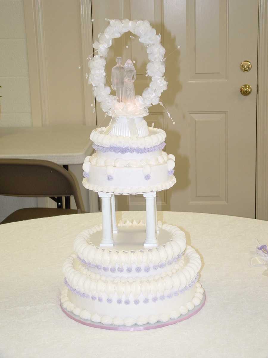 Round White Wedding Cake With Lavender Accents - CakeCentral.com