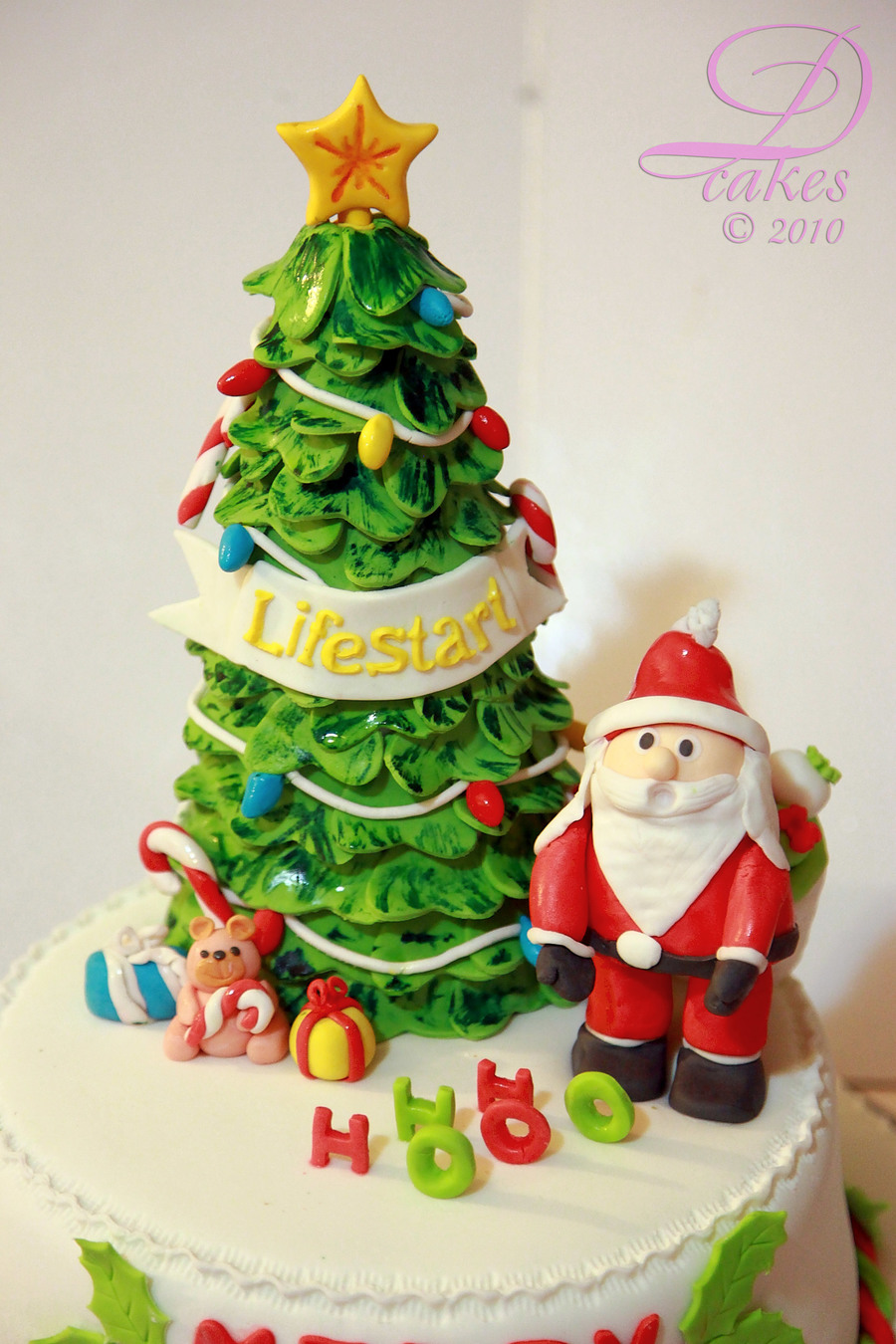 Christmas Tree And Santa Fondant Cake - CakeCentral.com