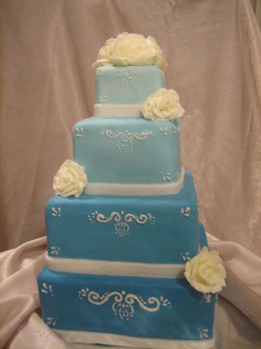 Stacked Blue Squares With Bc Roses - CakeCentral.com