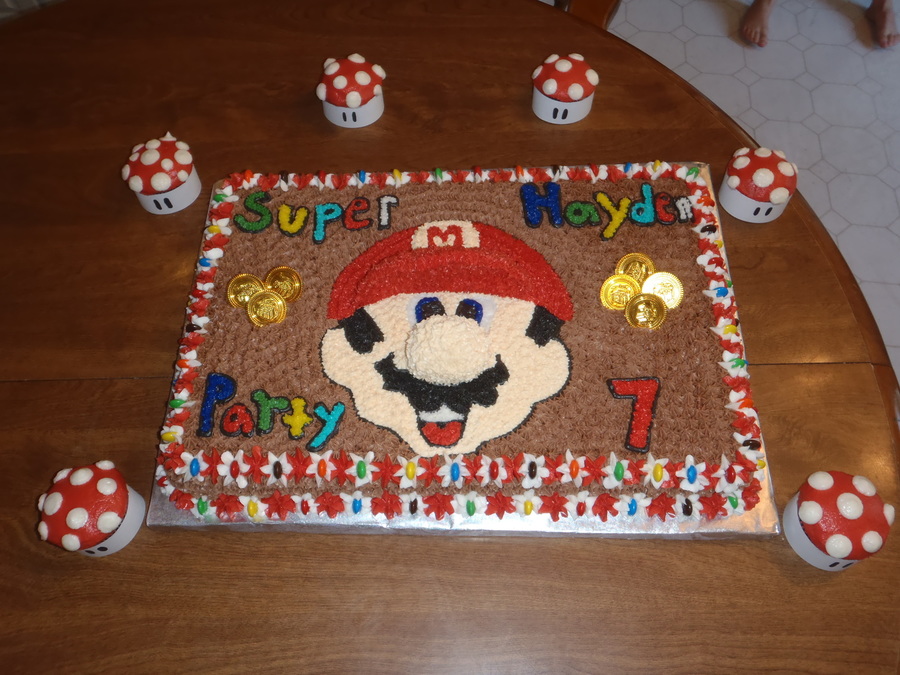 Super Mario Cookie Cake With Mushroom Cupcakes - CakeCentral.com