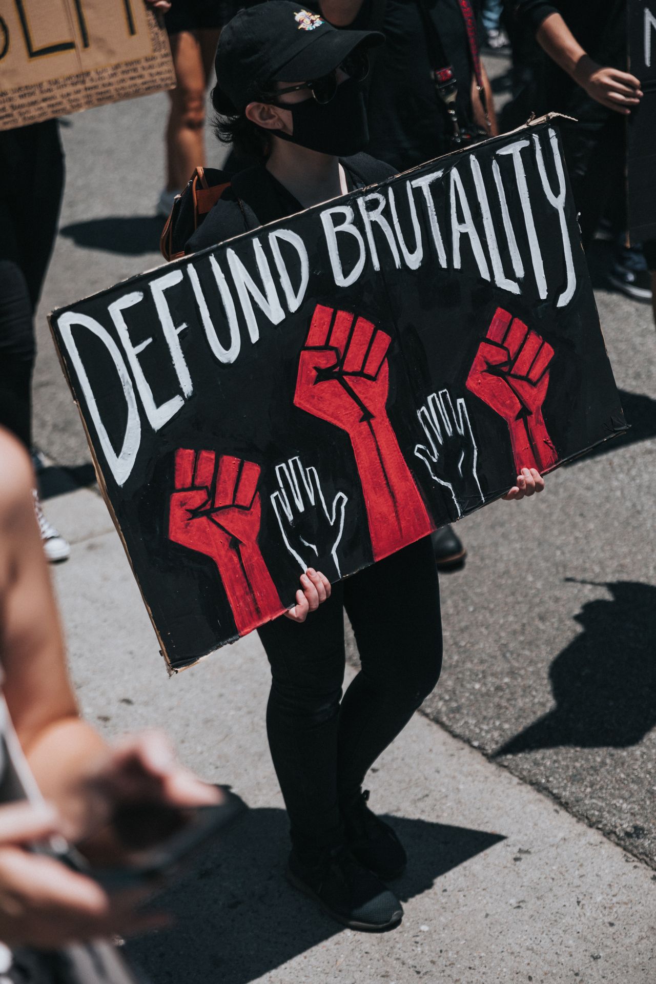 Photo | Defund Brutality sign at a demonstration | UCLA
