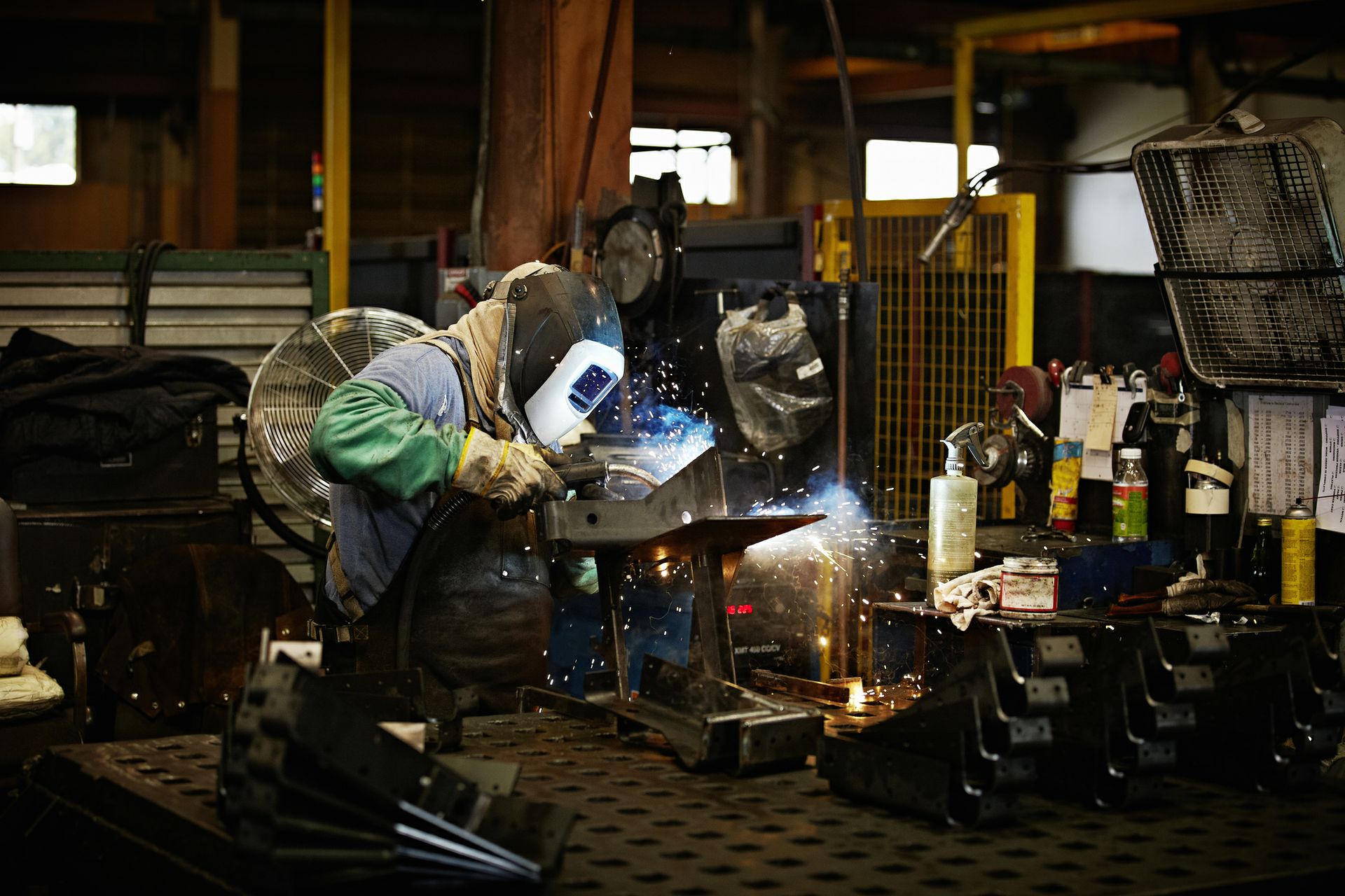 Photo | Welder at work inside a workshop | UCLA