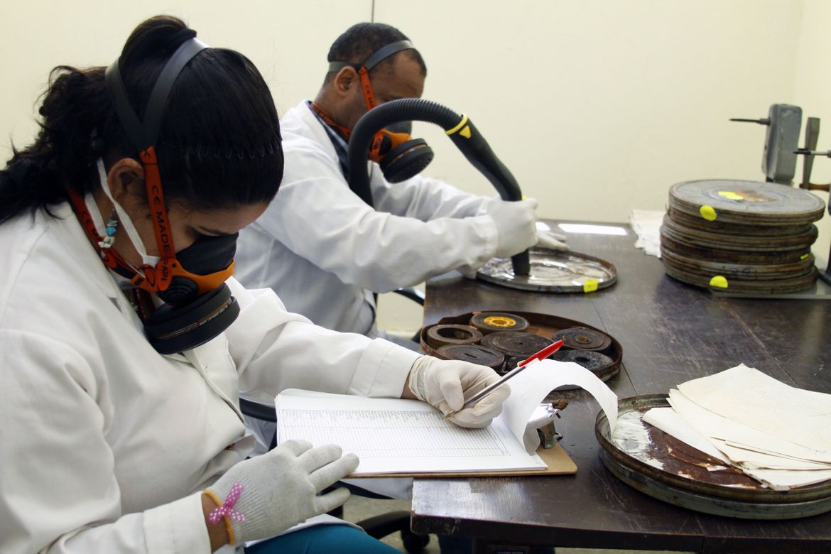 Photo | Two people doing preservation work | UCLA