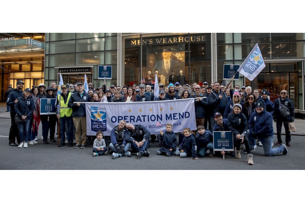 Photo | Large group of people pose behind and in front of Operation ...
