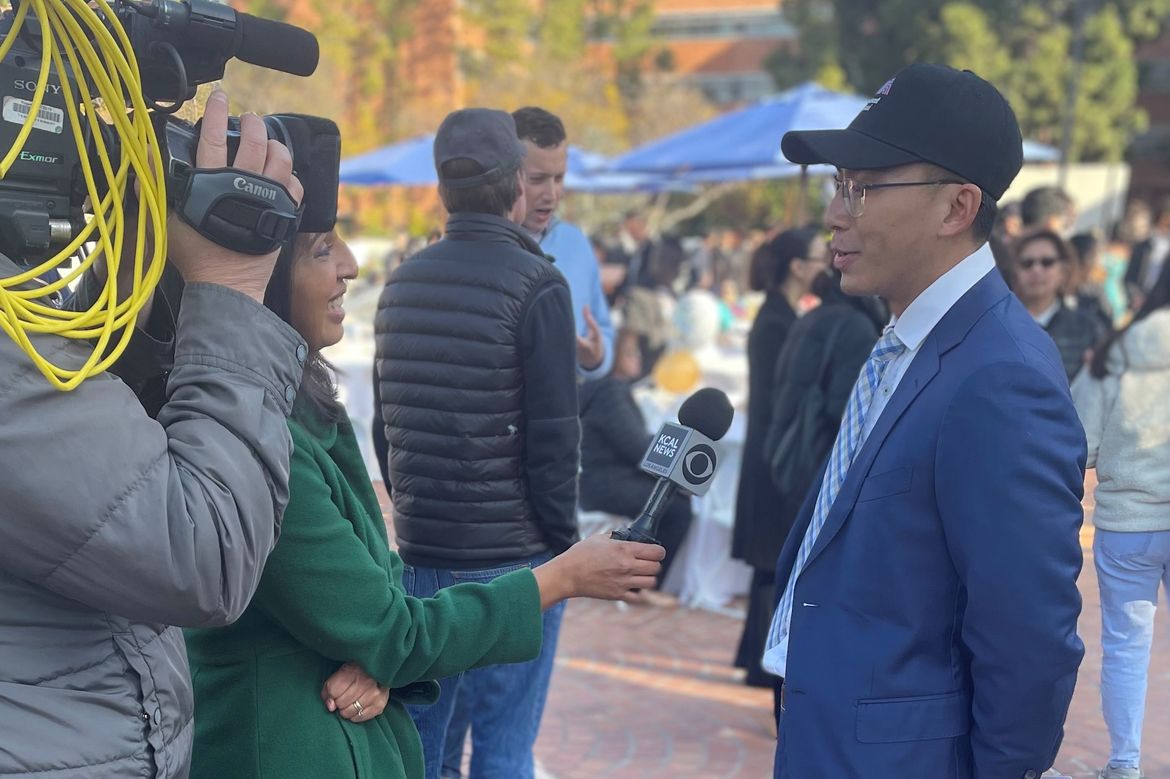 Photo | Michael Minh Le being interviewed by a TV reporter | UCLA