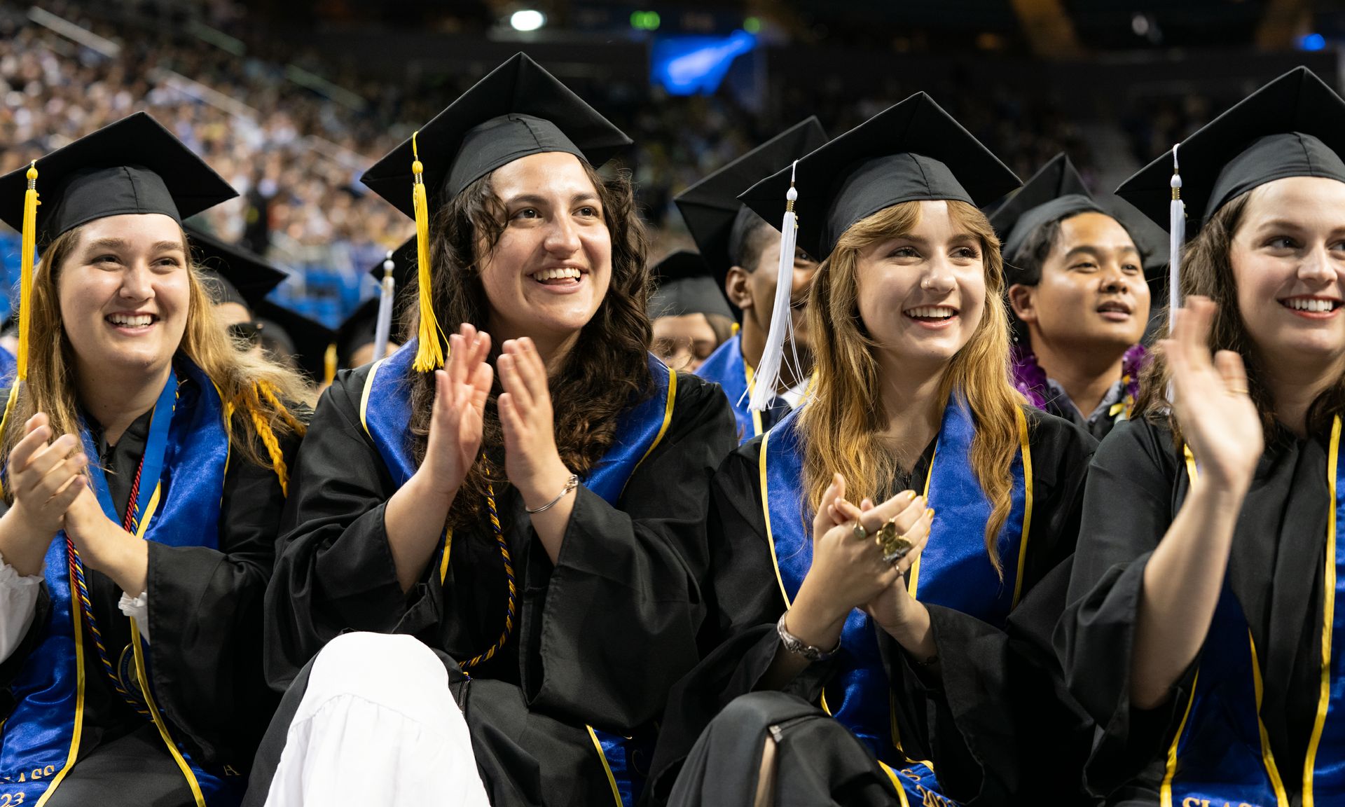 Photo | Graduates applauding at UCLA College commencement | UCLA
