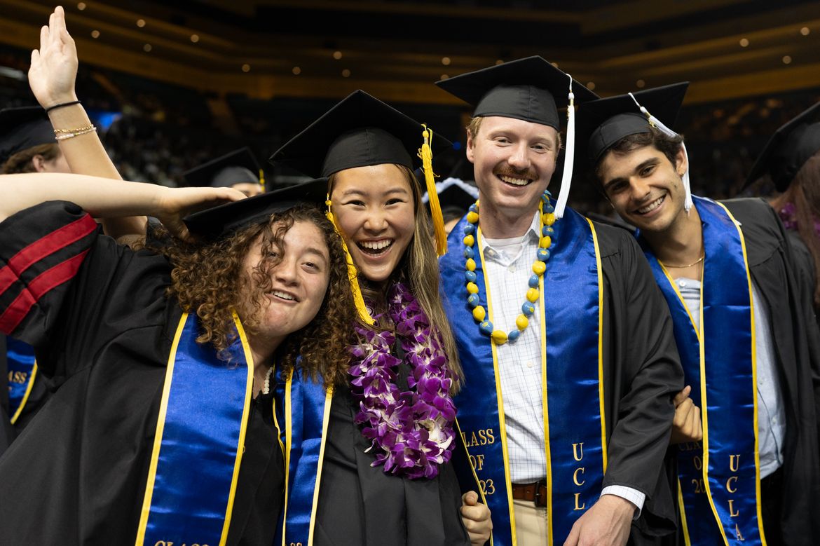 Photo | UCLA graduates celebrating in Pauley Pavilion | UCLA