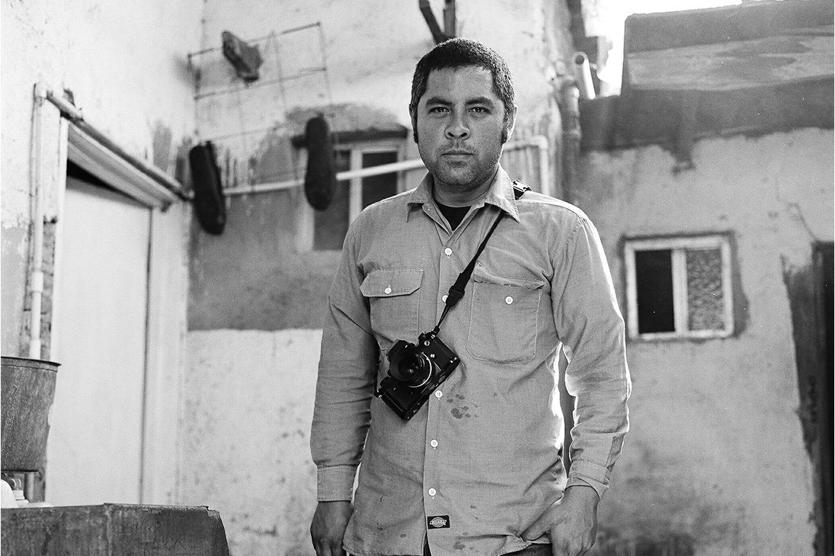 Photo | Jason De León standing with camera | UCLA