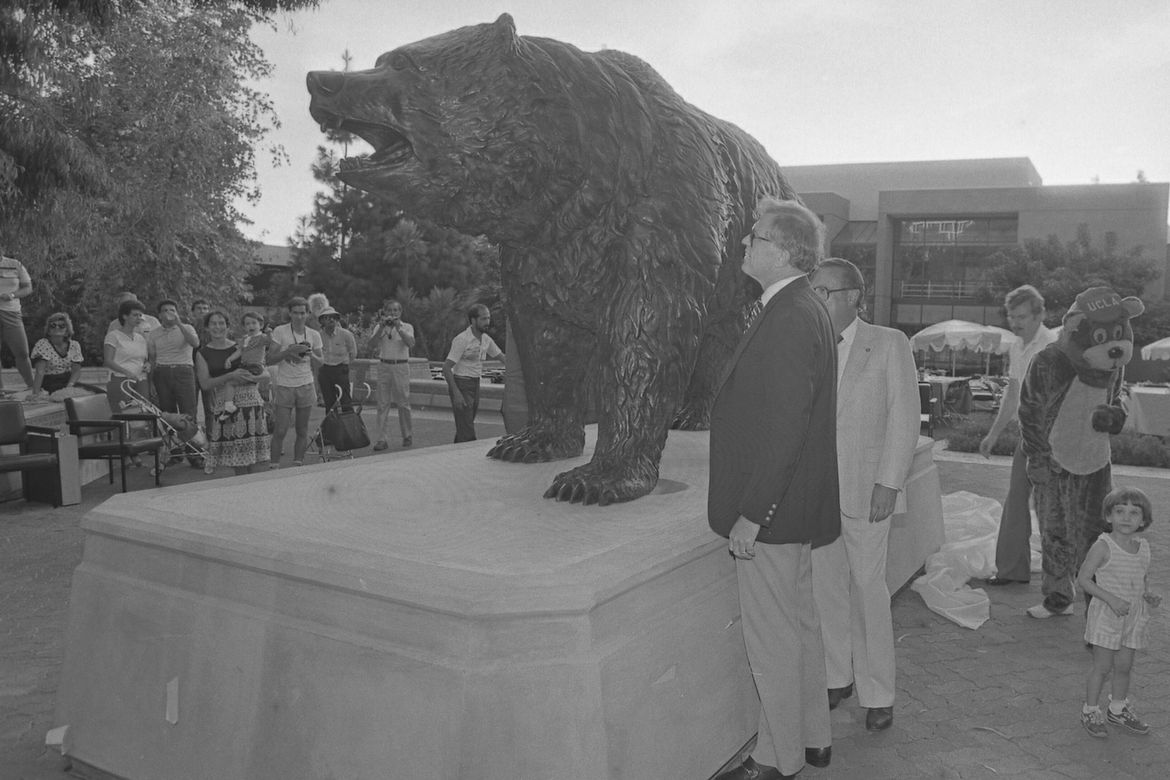 Photo | Chancellor Young stands next to “The Bruin” statue, surrounded ...