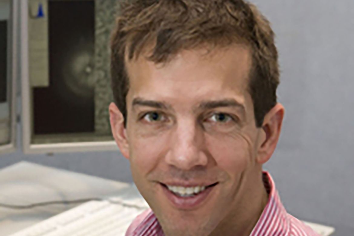 Photo | Close-up of Chris Regan in red-and-white striped shirt | UCLA