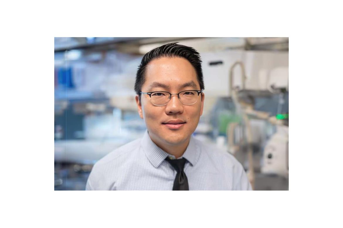 Photo | John Lee wearing glasses and necktie | UCLA