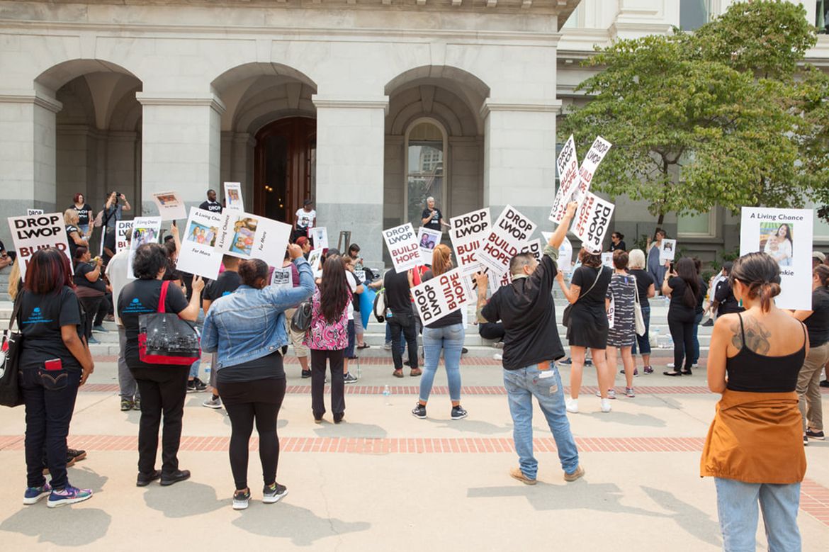 Photo | People holding up signs supporting the end of life without ...