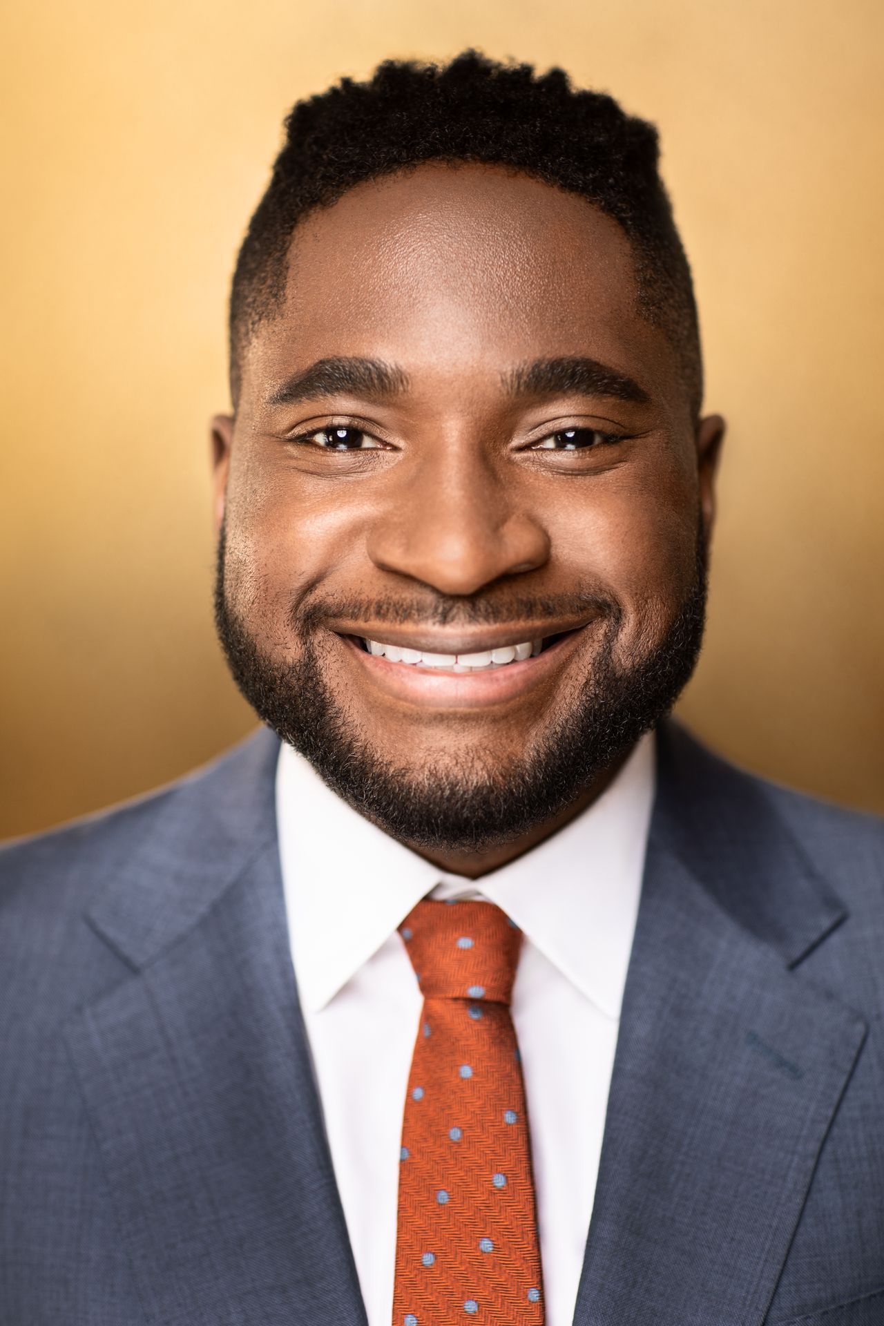 Photo | Head-and-shoulders shot of Utibe Essien in suit and tie | UCLA