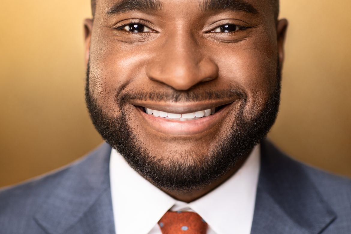 Photo | Head-and-shoulders shot of Utibe Essien in suit and tie | UCLA