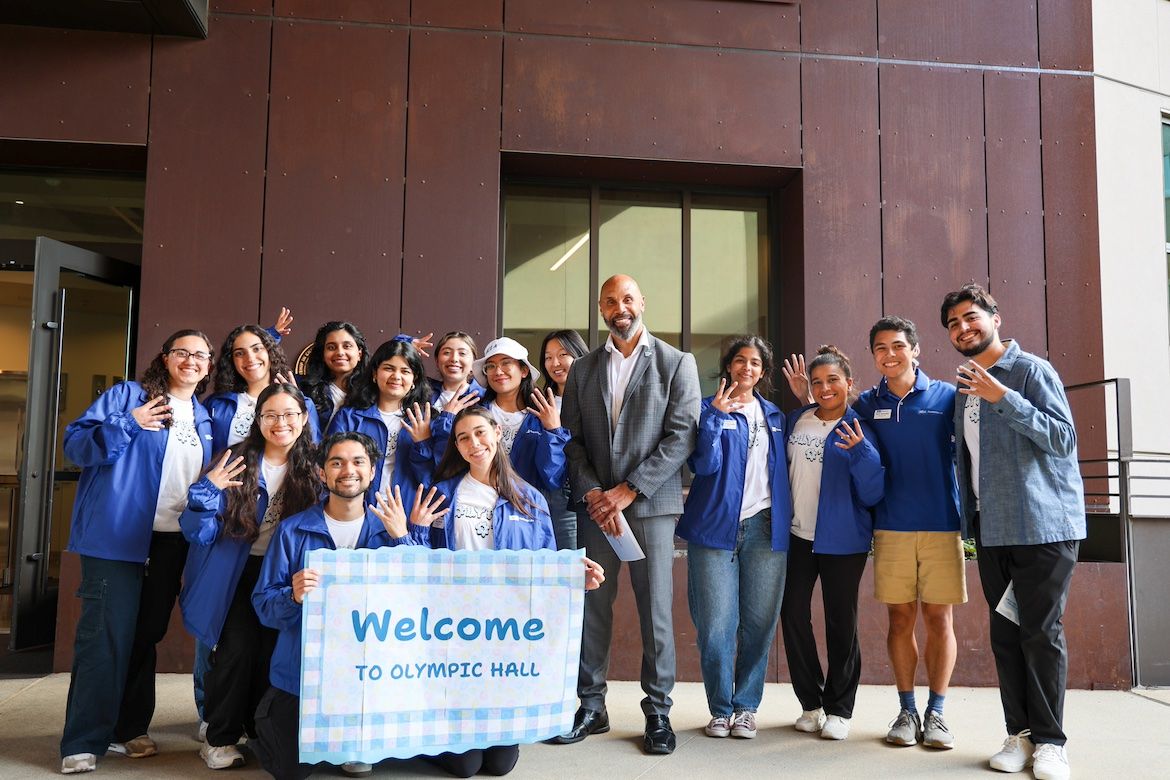 Photo | Darnell Hunt with group of students outside Olympic Hall during ...