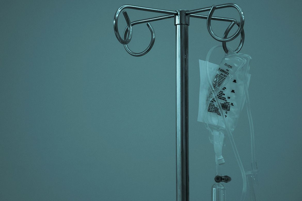 Photo | An IV bag hanging on a drip stand | UCLA