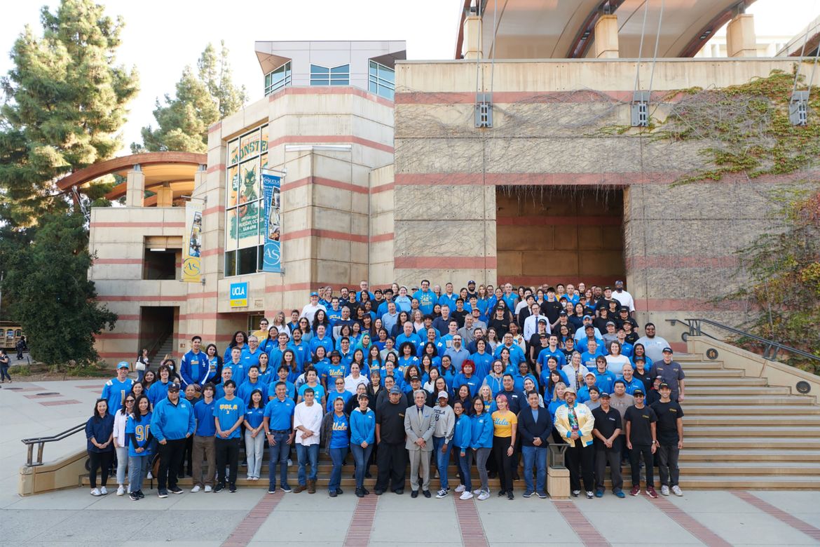 Photo | ASUCLA staff in blue shirts standing on steps outside Ackerman ...
